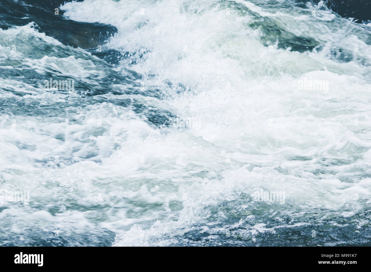 A powerful stream of mountain river. The fast current of water Stock ...
