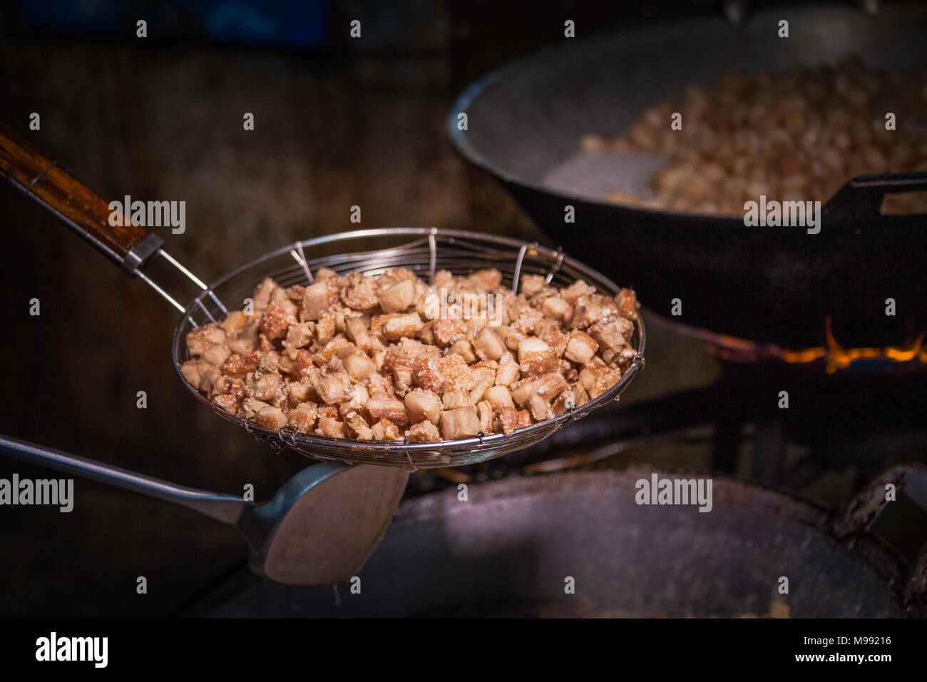 Fry the pork skin in a large frying pan on the stove.We will have a ...