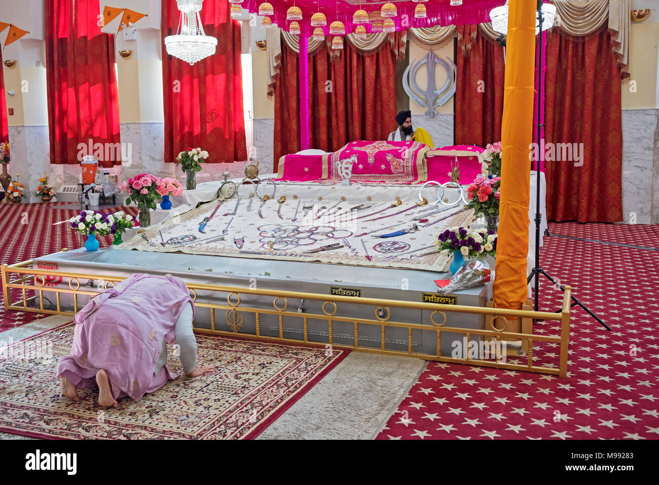 A Sikh woman at the alter in the Gurdwara Sikh Cultural Society in ...