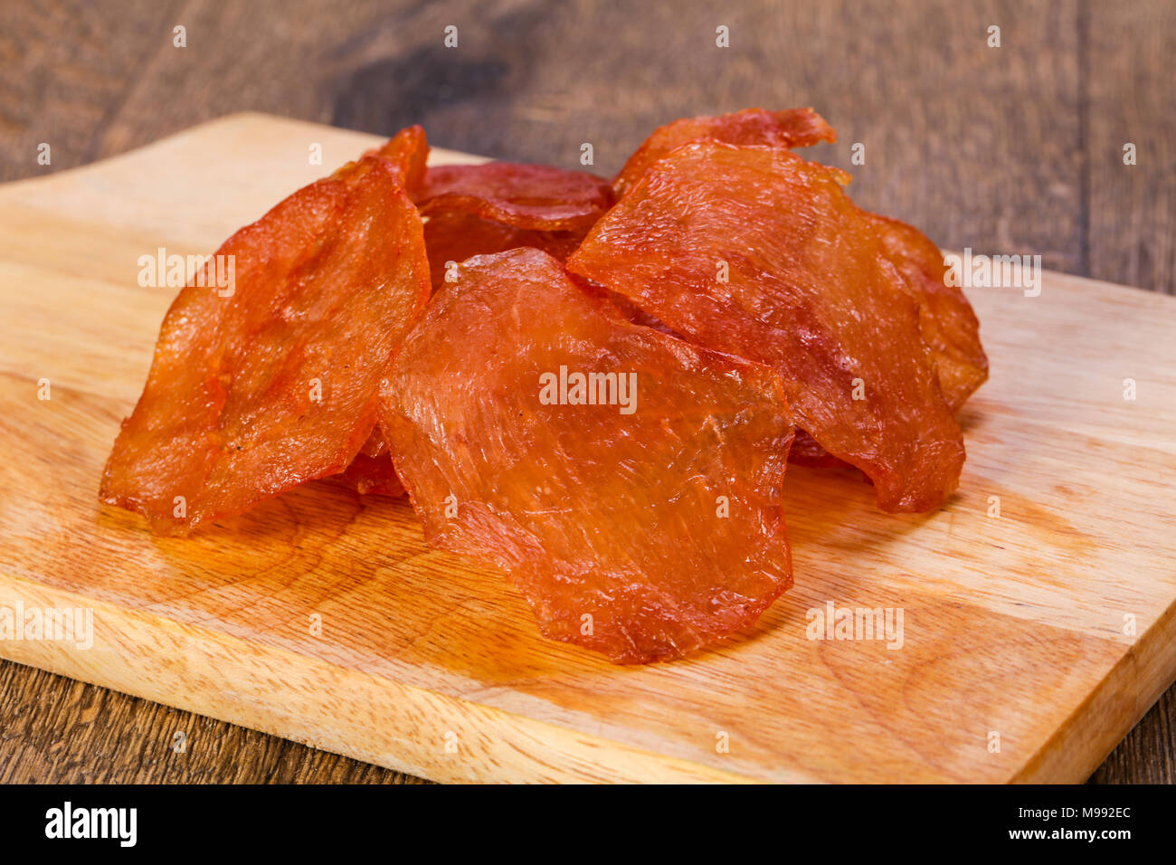 Dry chicken meat over wooden Stock Photo - Alamy