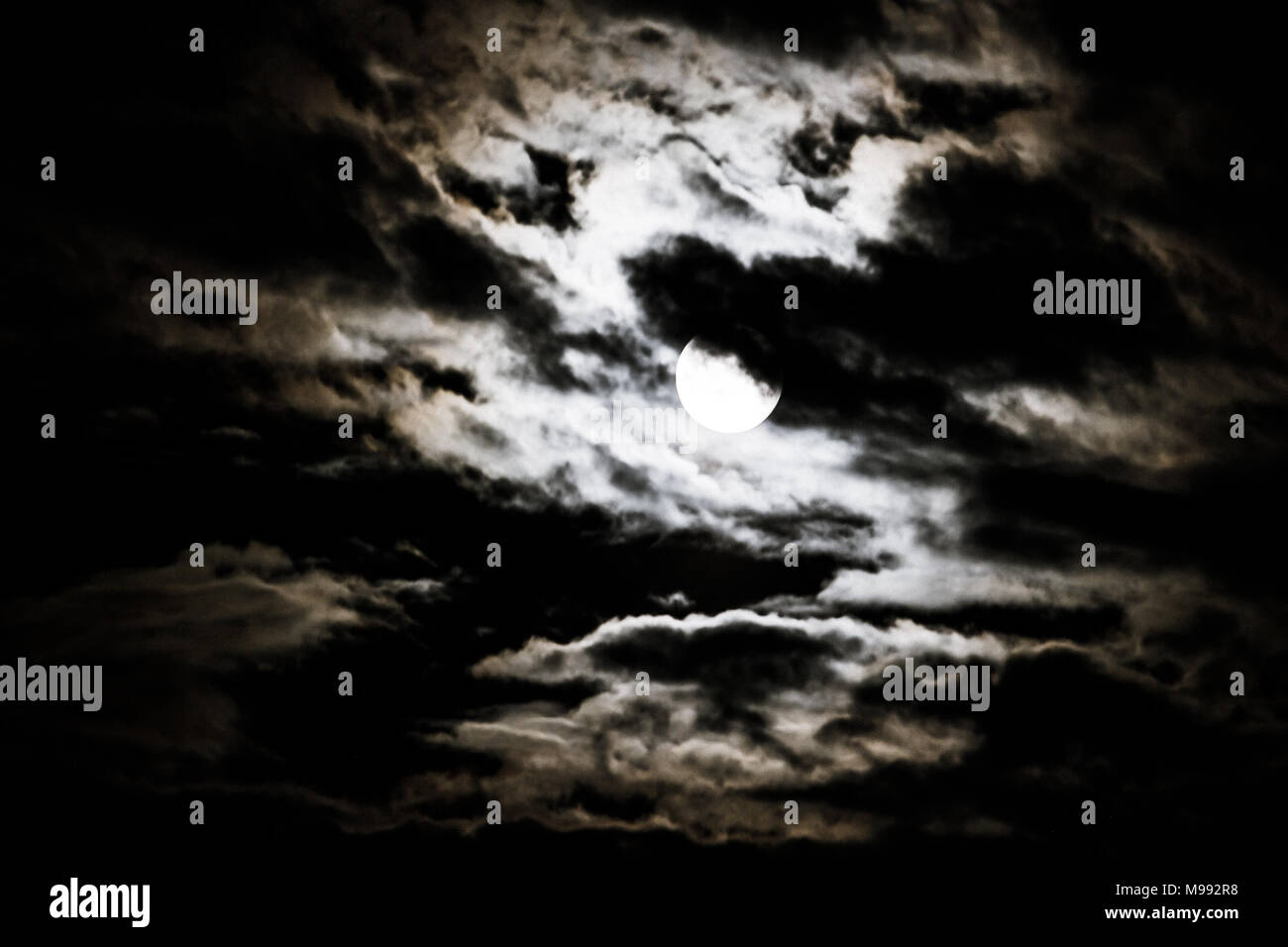 Night moon in silver clouds Stock Photo - Alamy