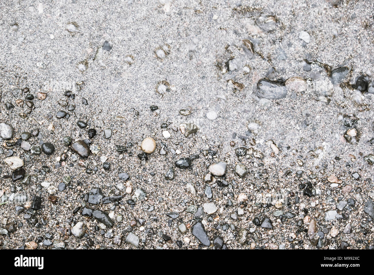 Sand and pebbles. Wave on a river, the sea Stock Photo - Alamy