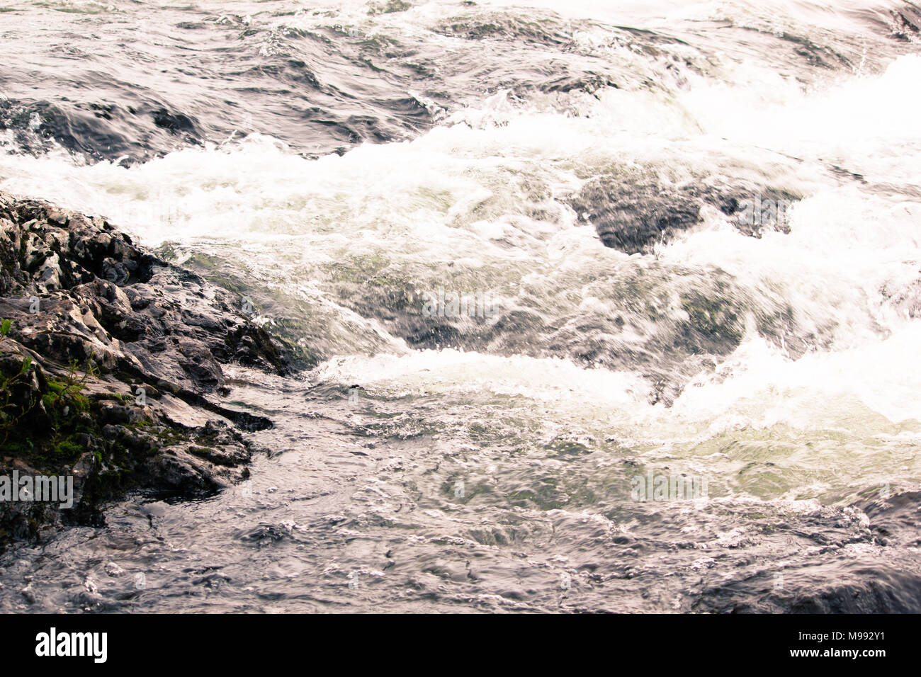 Mountain river. Water flow close-up as background Stock Photo - Alamy