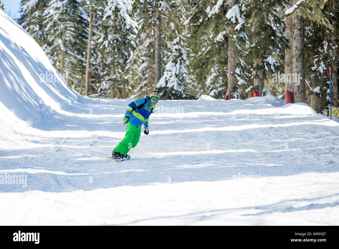 Image of man riding snowboard from snowy hill Stock Photo - Alamy