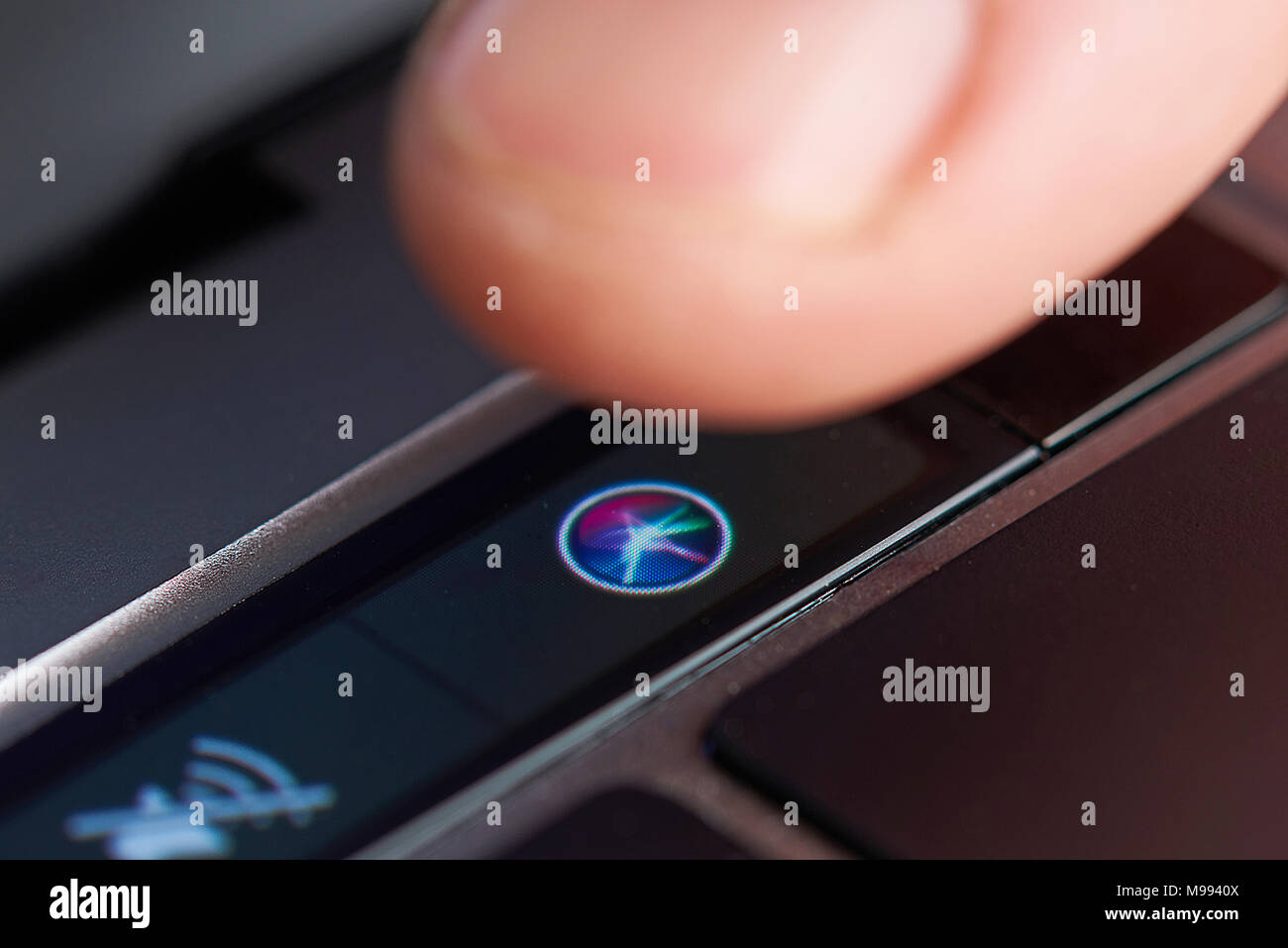 New york, USA - March 23, 2018: Press Siri button on touch bar of ...