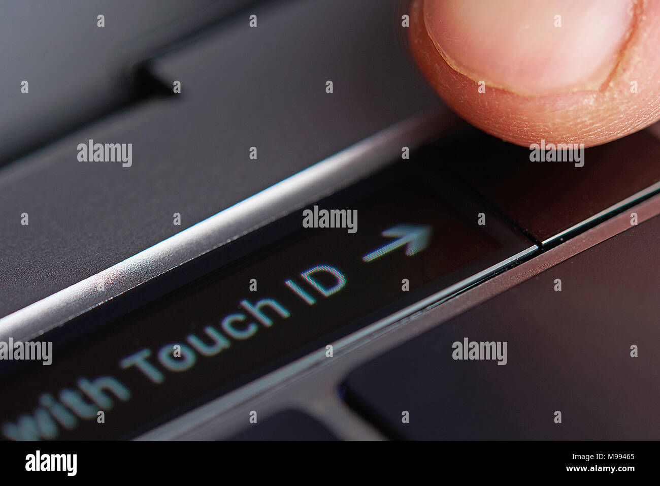 New york, USA - March 23, 2018: Using touch id to unlock macbook pro ...