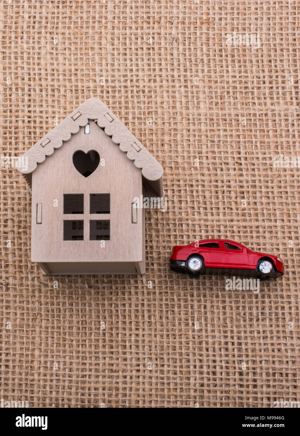 Model car and a little model house on a canvas background Stock Photo ...