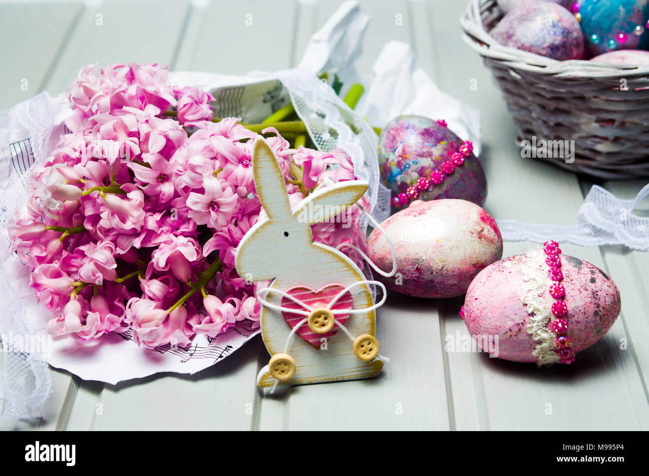 Easter bunny with decorated eggs and fresh hyacinth flowers Stock Photo ...