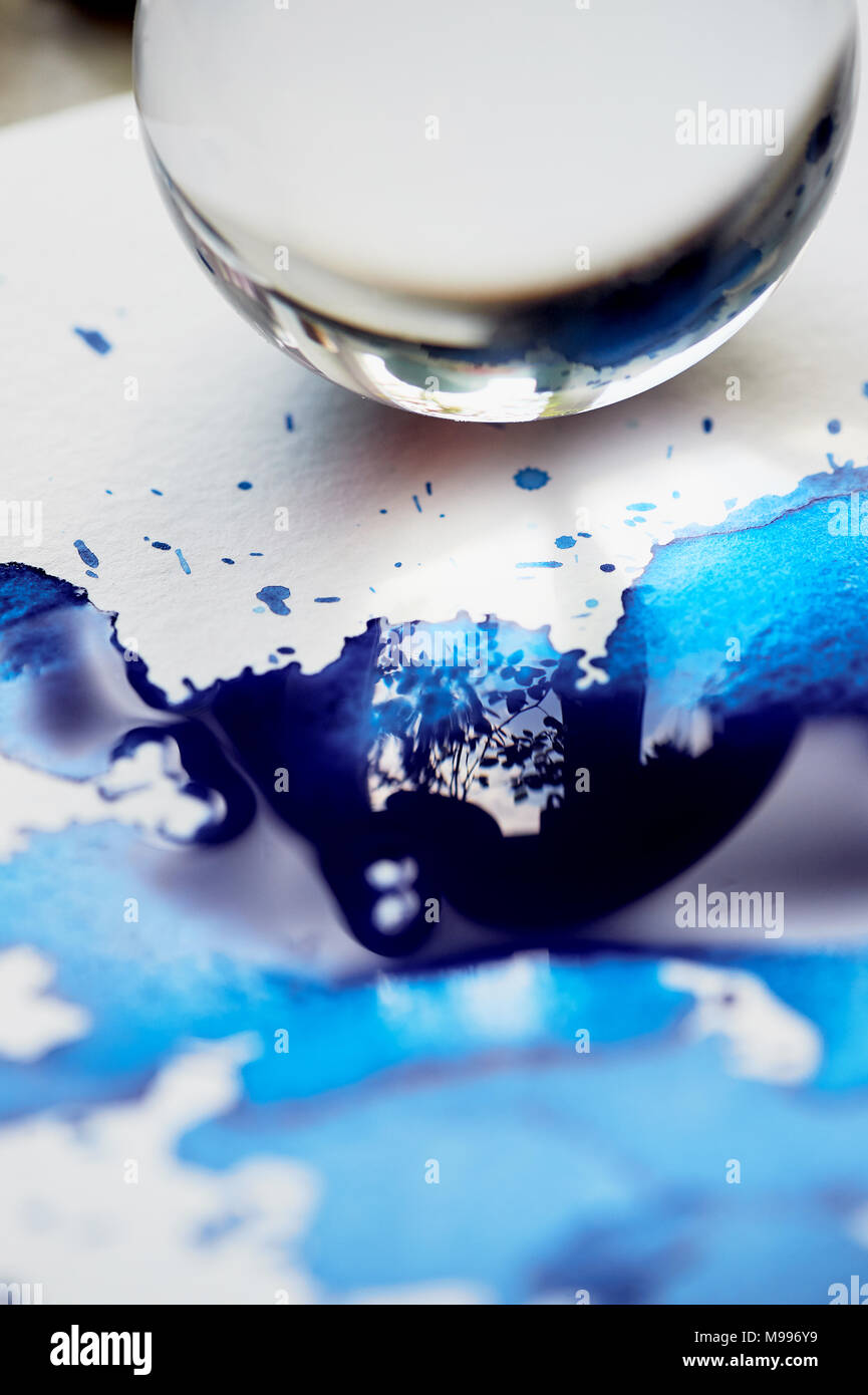 glass bowl and reflection in blue ink puddle.Abstraction Stock Photo ...