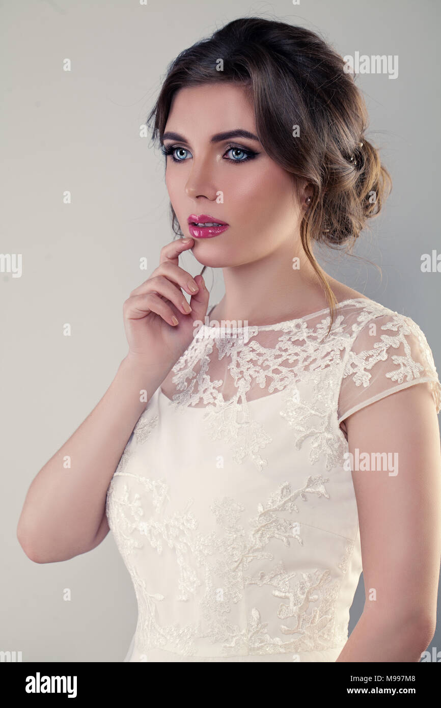 Cute Bride with Beautiful Hairstyle and Makeup Stock Photo - Alamy