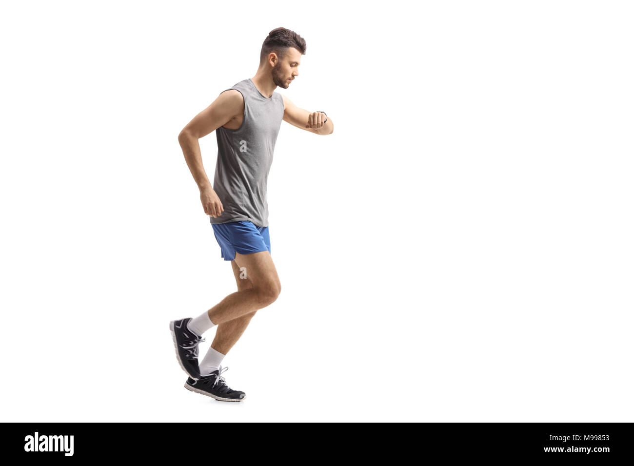 Full length profile shot of an athletic guy running and looking at his ...