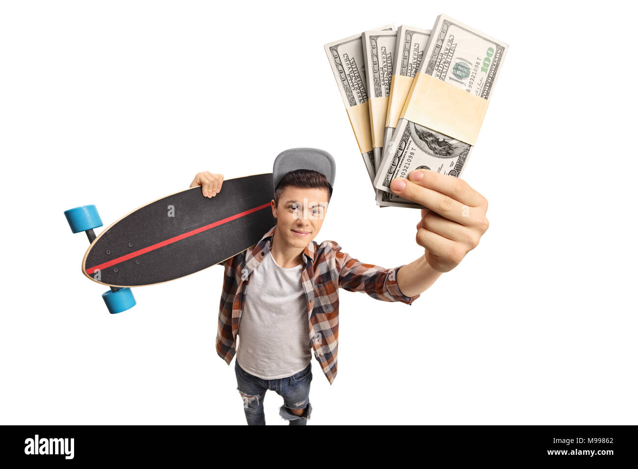 Teenage skater holding a longboard and showing money bundles isolated ...