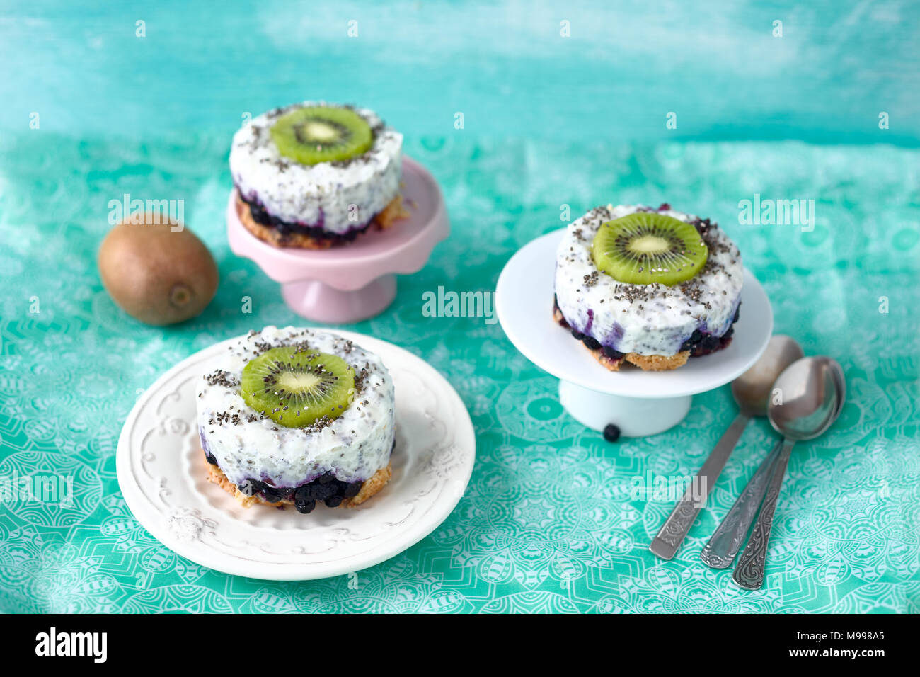 Chia seed kiwi milk rice cakes Stock Photo - Alamy