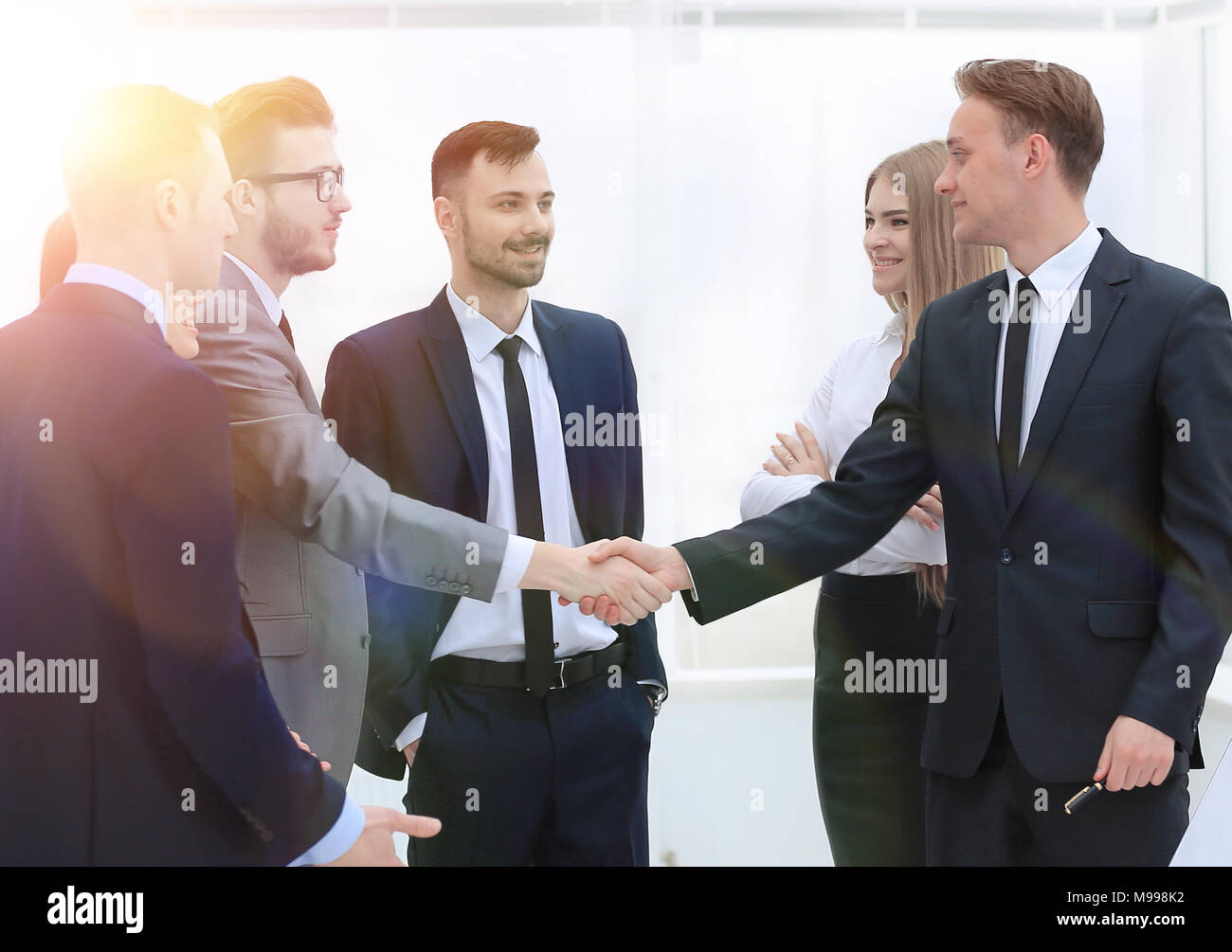 handshake Manager and the client in the office Stock Photo - Alamy