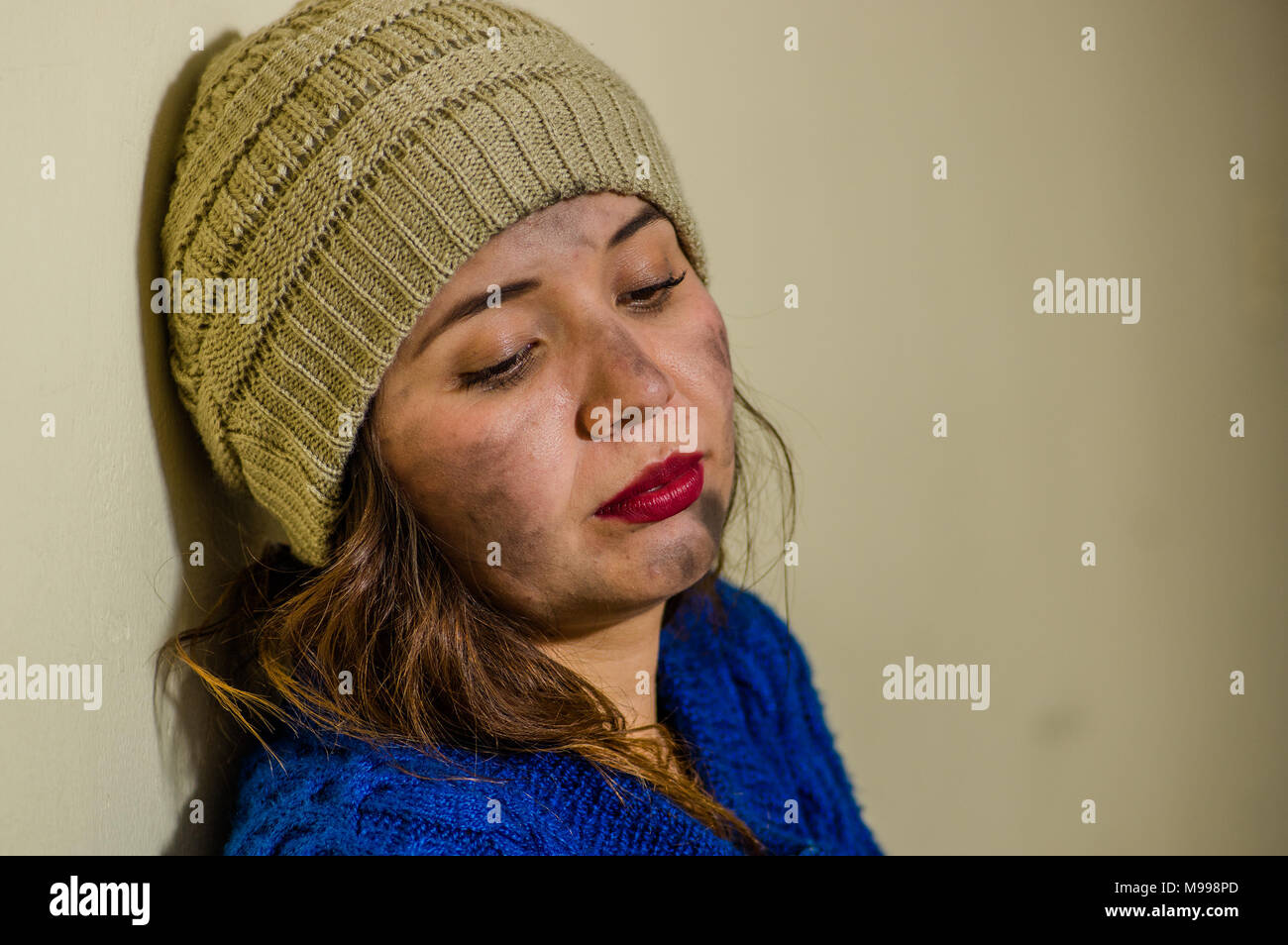 Portrait of homeless woman on the street in cold autumn weather wearing ...