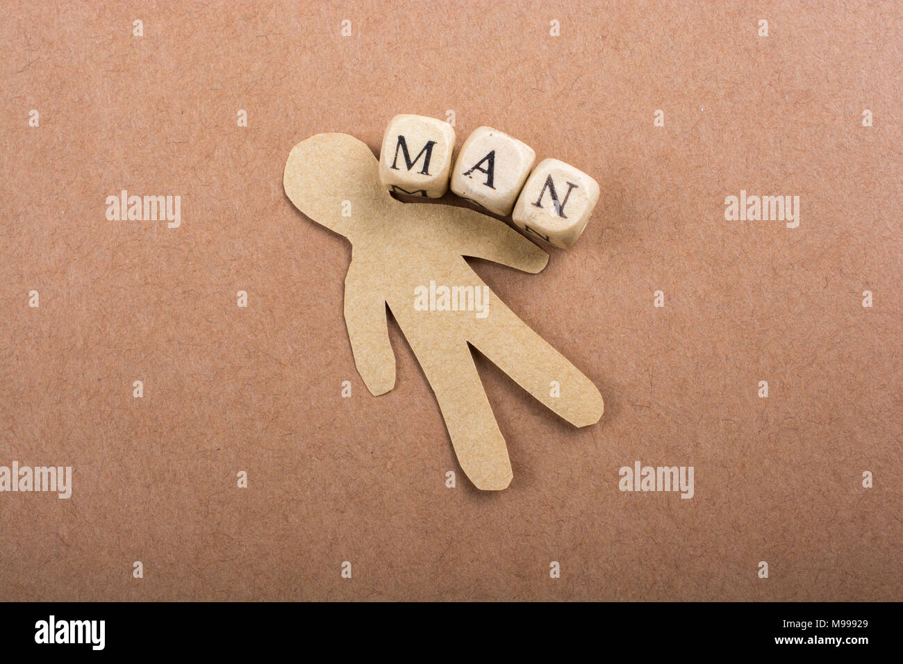 Paper man and man wording with letter cubes on paper Stock Photo - Alamy
