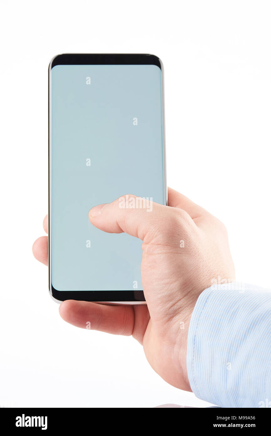 Touching smartphone screen with one hand isolated on white background ...