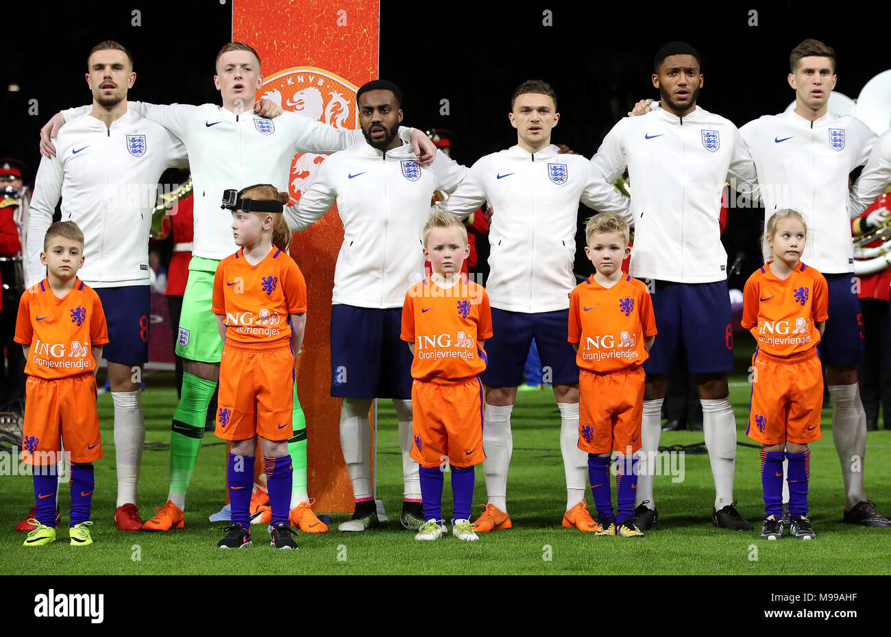 England players line up to sing the National Anthem during the ...