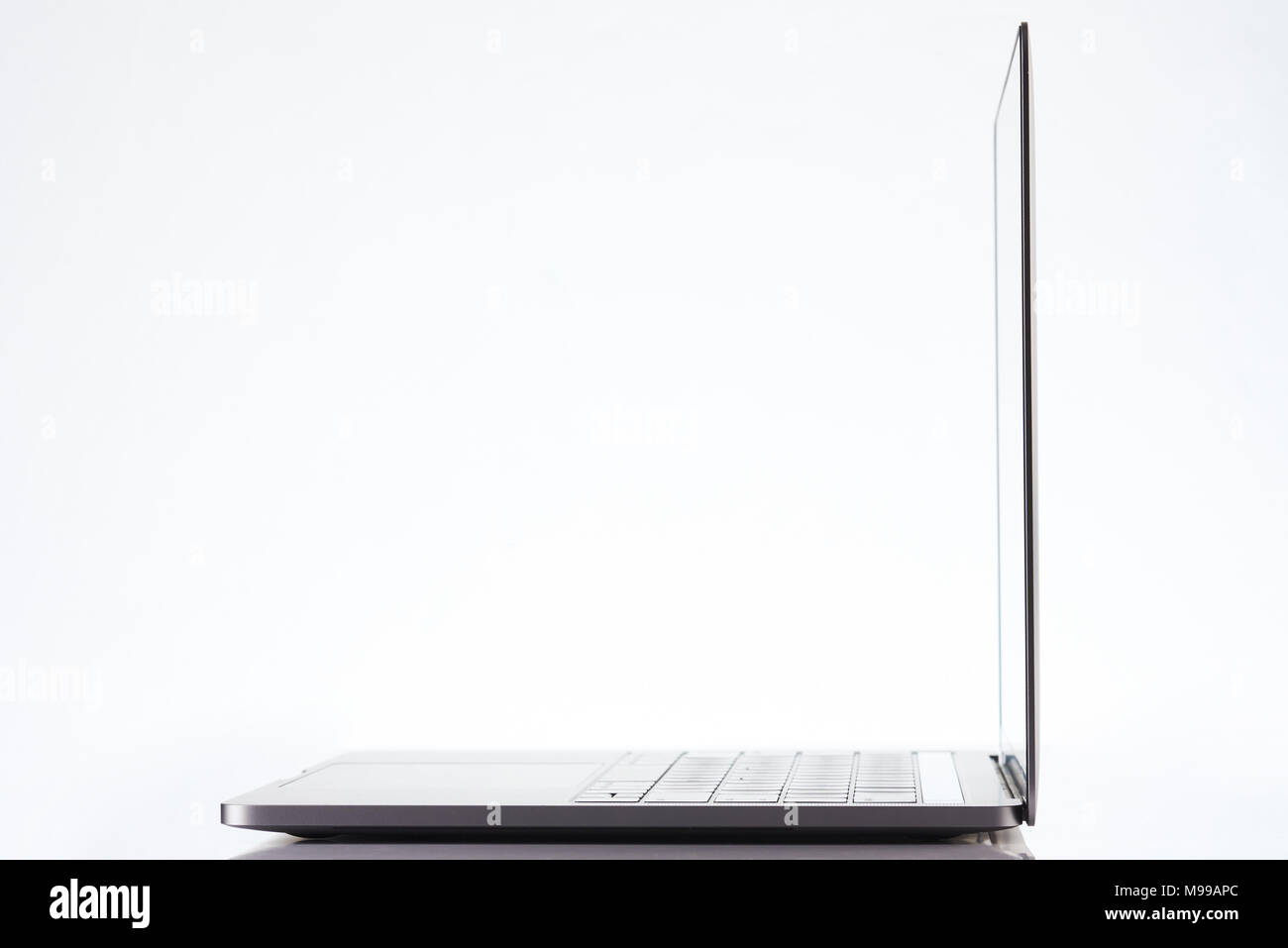 Side view of modern laptop isolated on white background Stock Photo - Alamy
