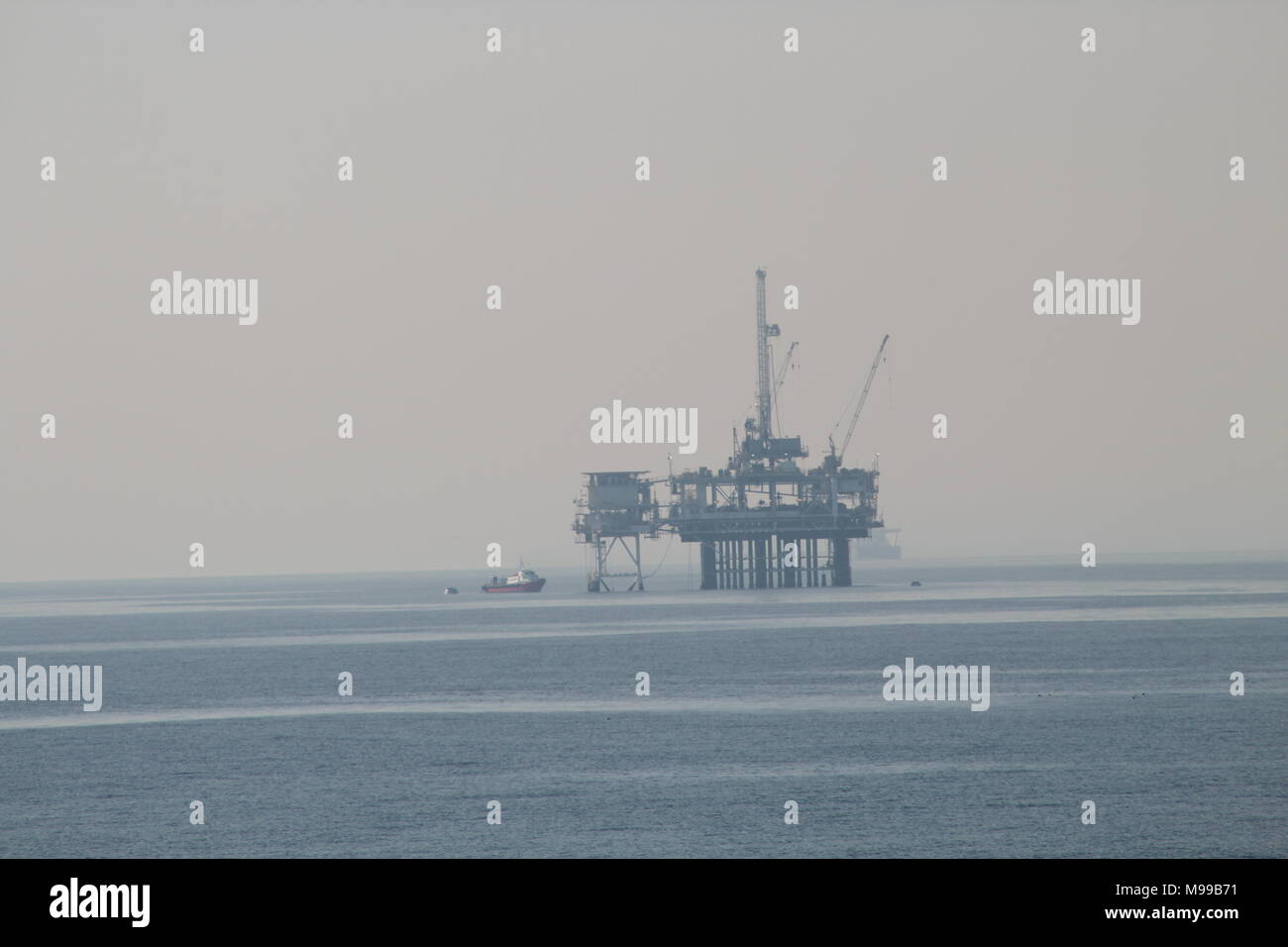 Off Shore Oil Platform and a Ship Stock Photo - Alamy