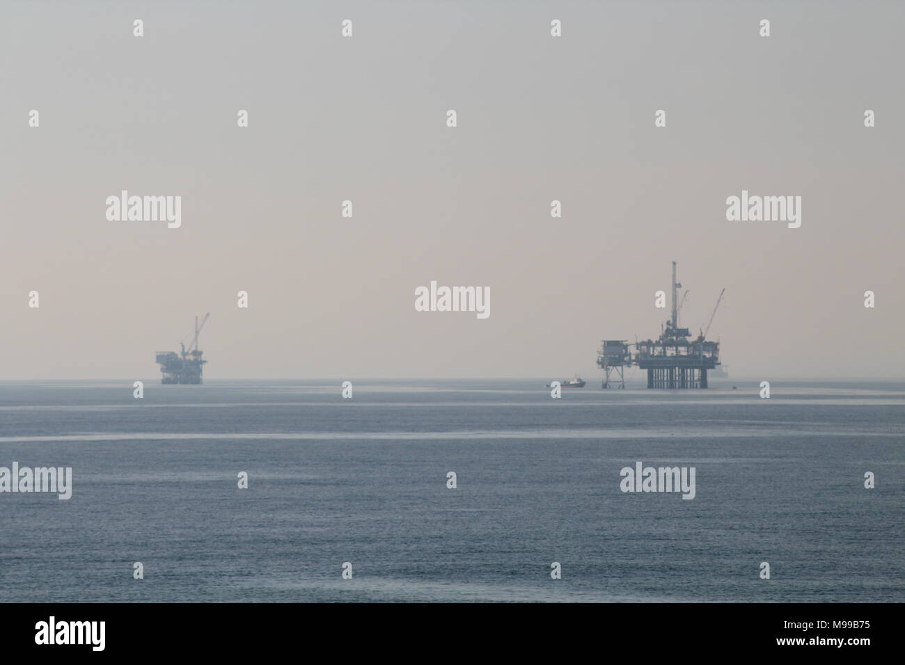 Off Shore Oil Platforms and a Ship Stock Photo - Alamy