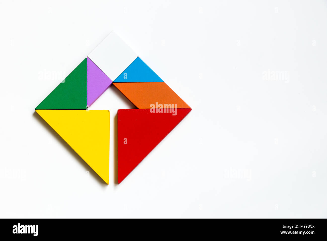 Colorwood tangram puzzle on square with arrow sign shape on white ...