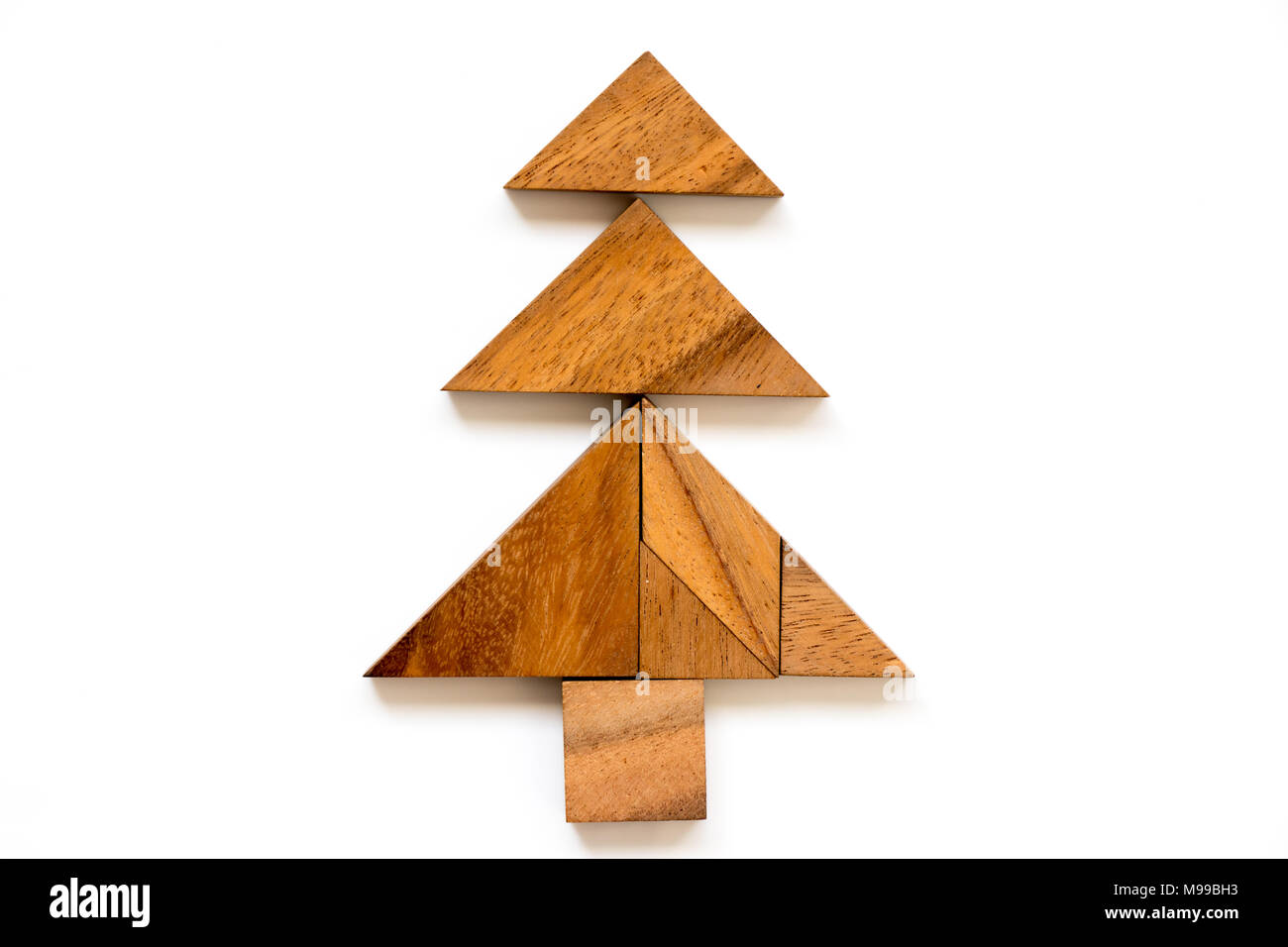 Wood tangram puzzle in christmas tree shape on white background Stock ...