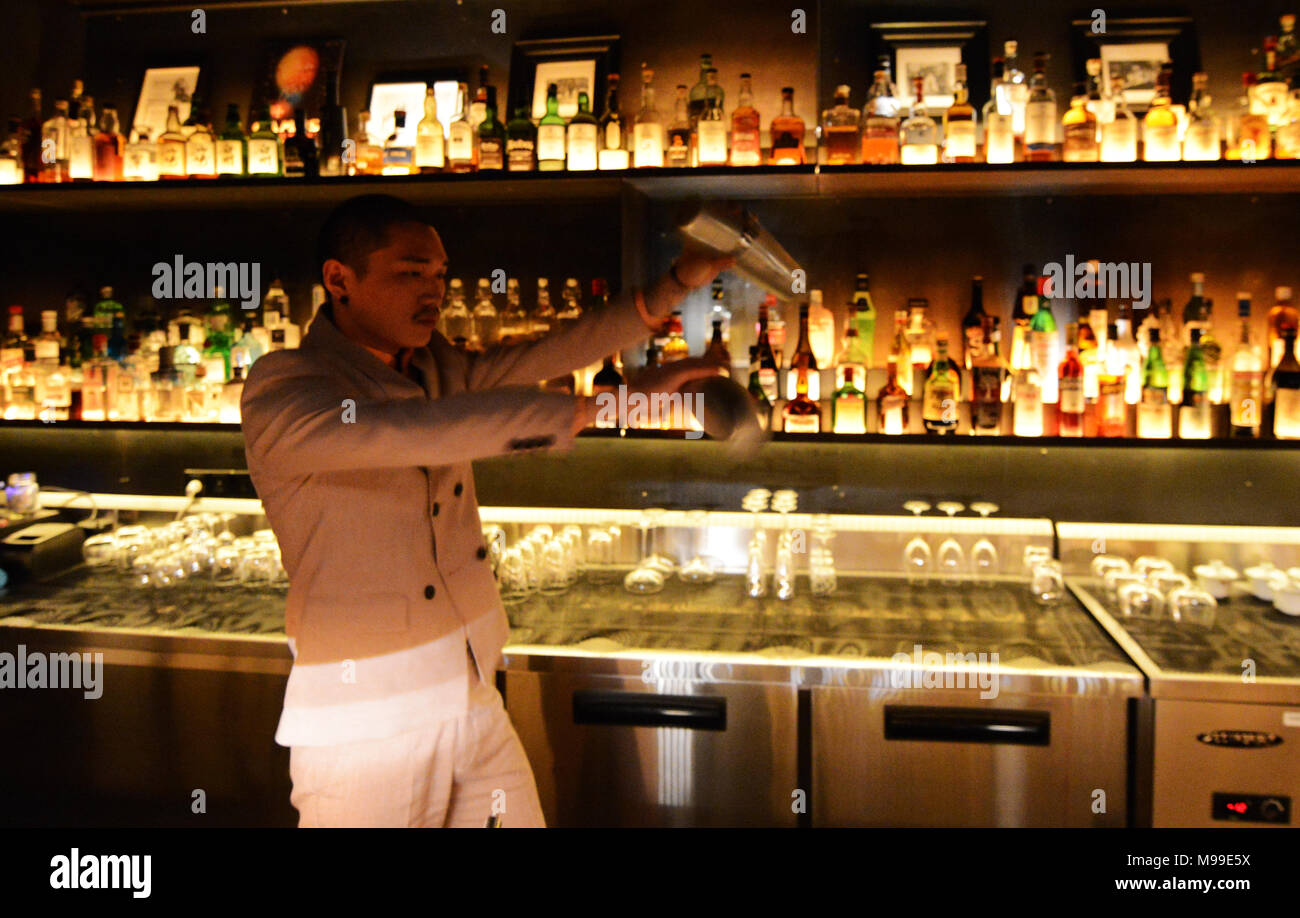 A barman mixing cocktails at the Mixy cocktail bar in Shenzhen Stock ...