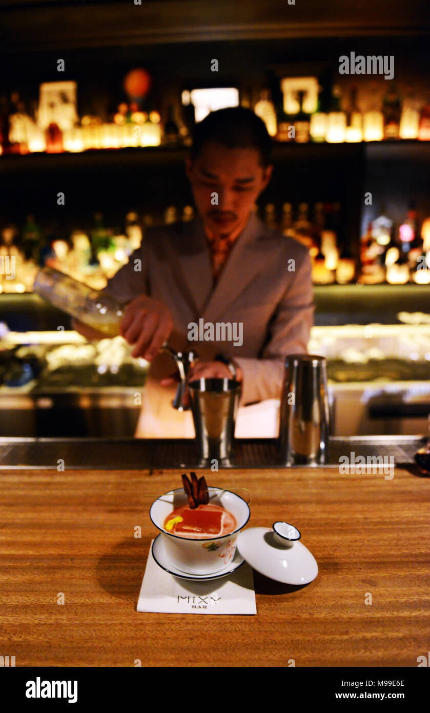 A barman mixing cocktails at the Mixy cocktail bar in Shenzhen Stock ...