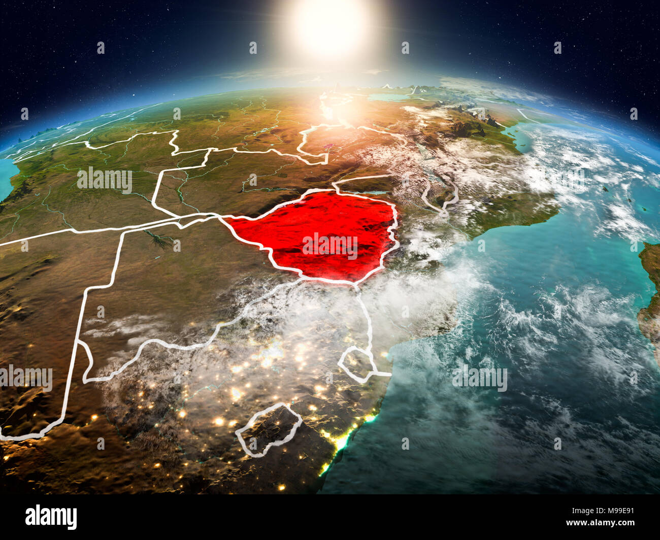 Sunrise above Zimbabwe highlighted in red on model of planet Earth in ...