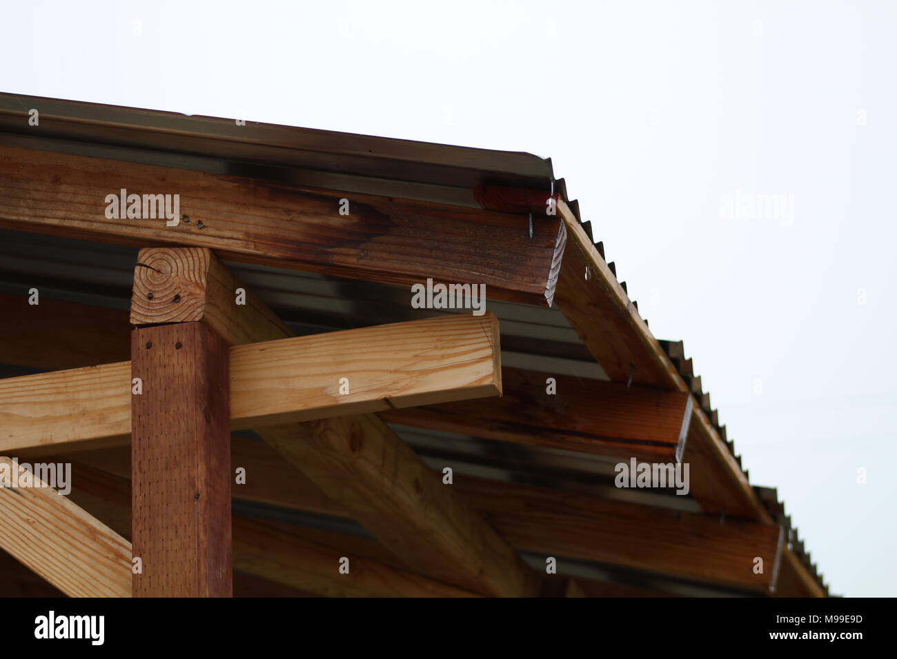 Wooden shelter with metal roof Stock Photo - Alamy
