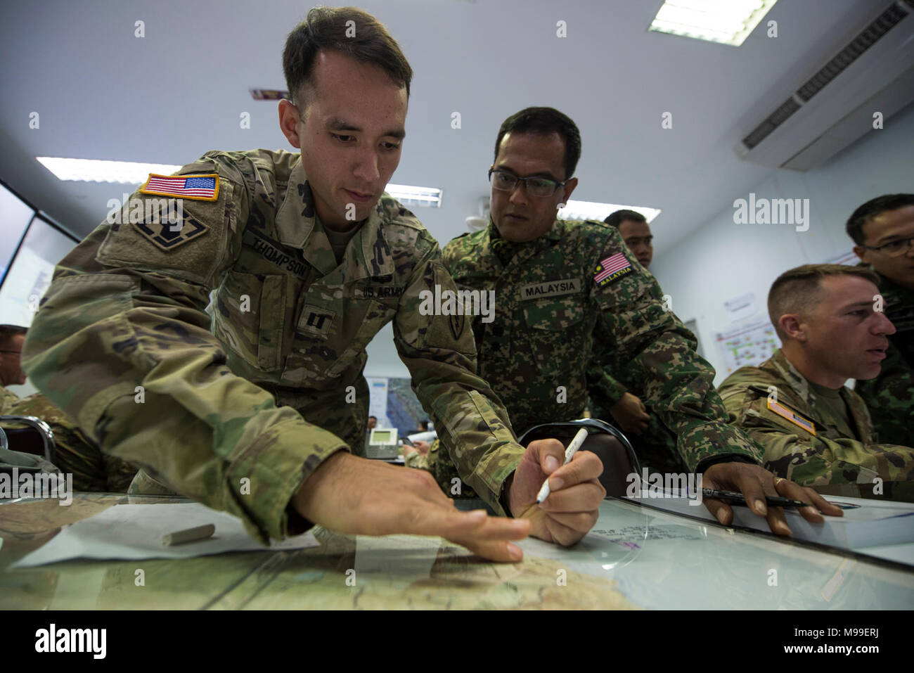 U.S. Army Capt. Benjamin Thompson, left, 25th Infantry Division force ...