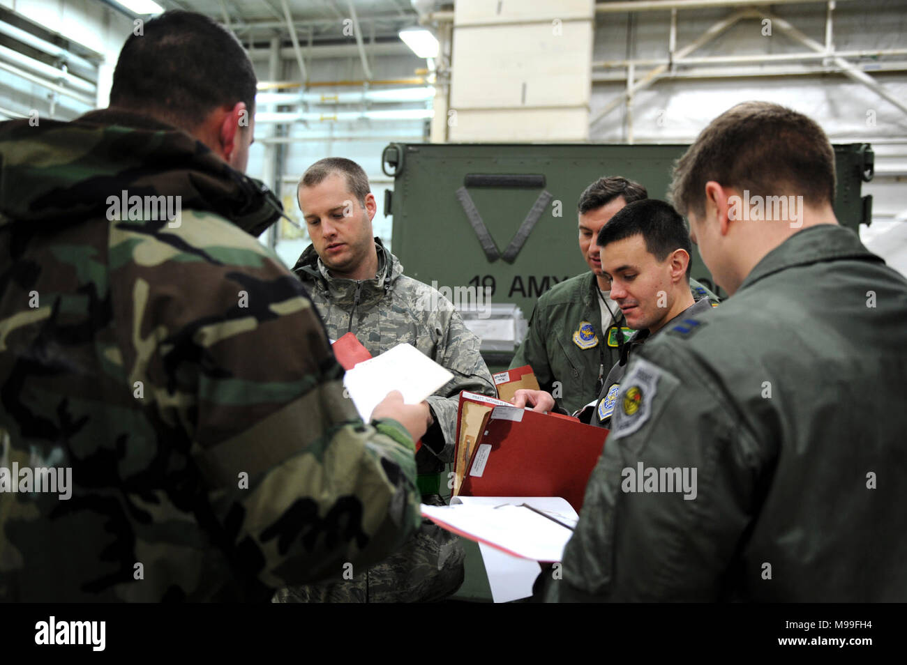 Exercise participants check their mobility folders for correct ...