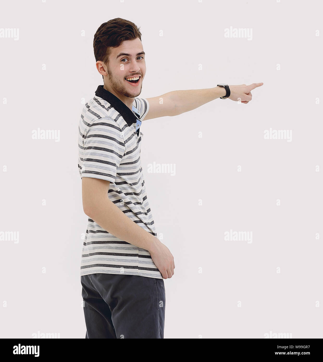 rear view.modern young man pointing forward Stock Photo - Alamy