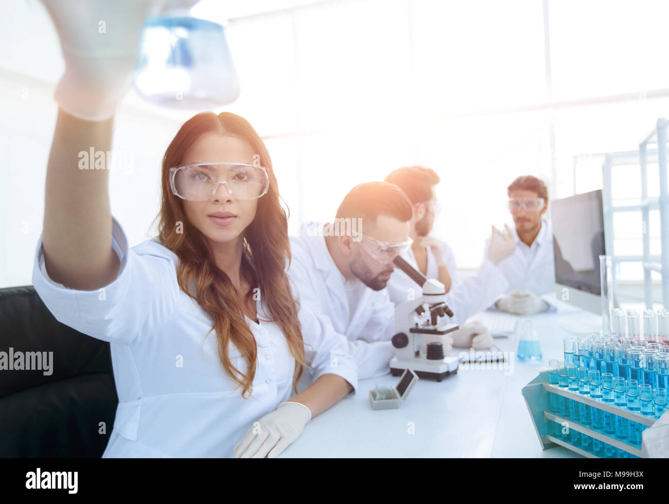 group of creative scientists working in a laboratory Stock Photo - Alamy