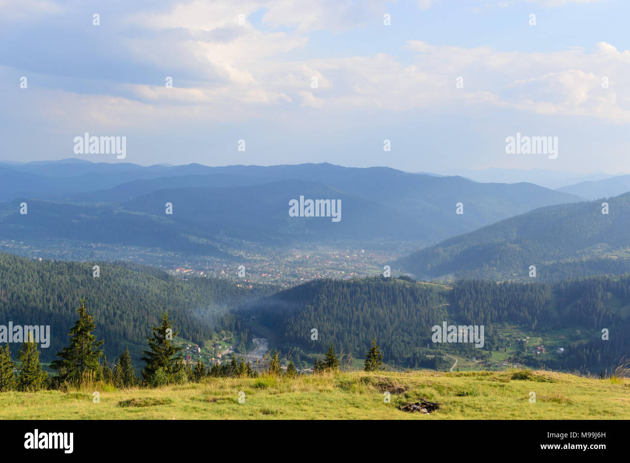 City at the bottom of the mountain landscape top view. Photo nature ...