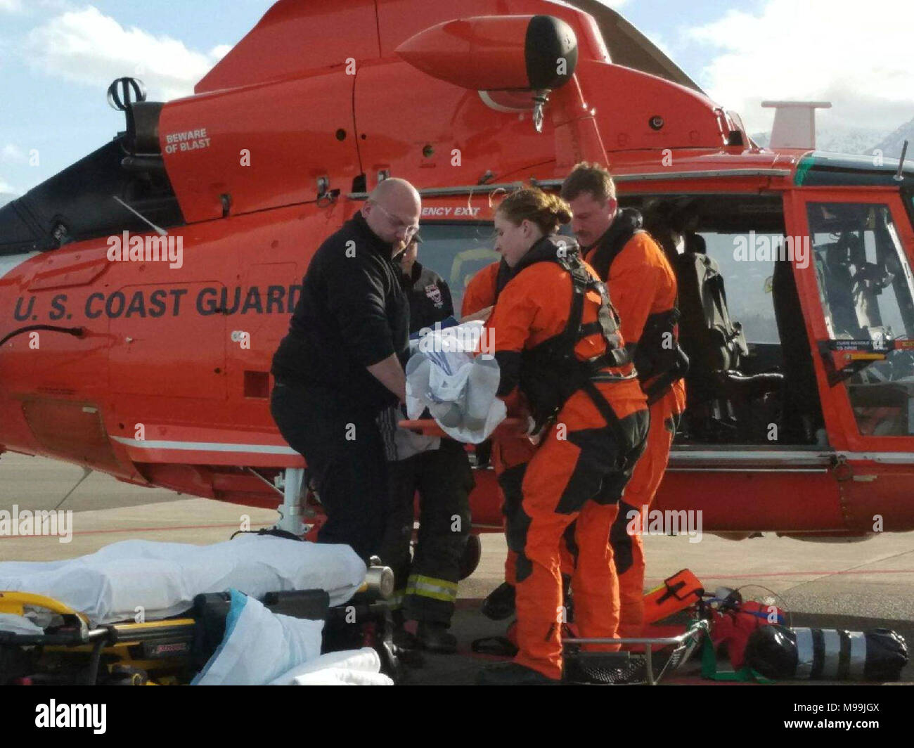 Members of a an MH-65 Dolphin helicopter crew, from Coast Guard Air ...