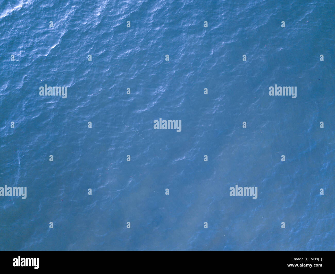 Top view of a sea. Aerial drone photo of ocean waves reaching shore ...