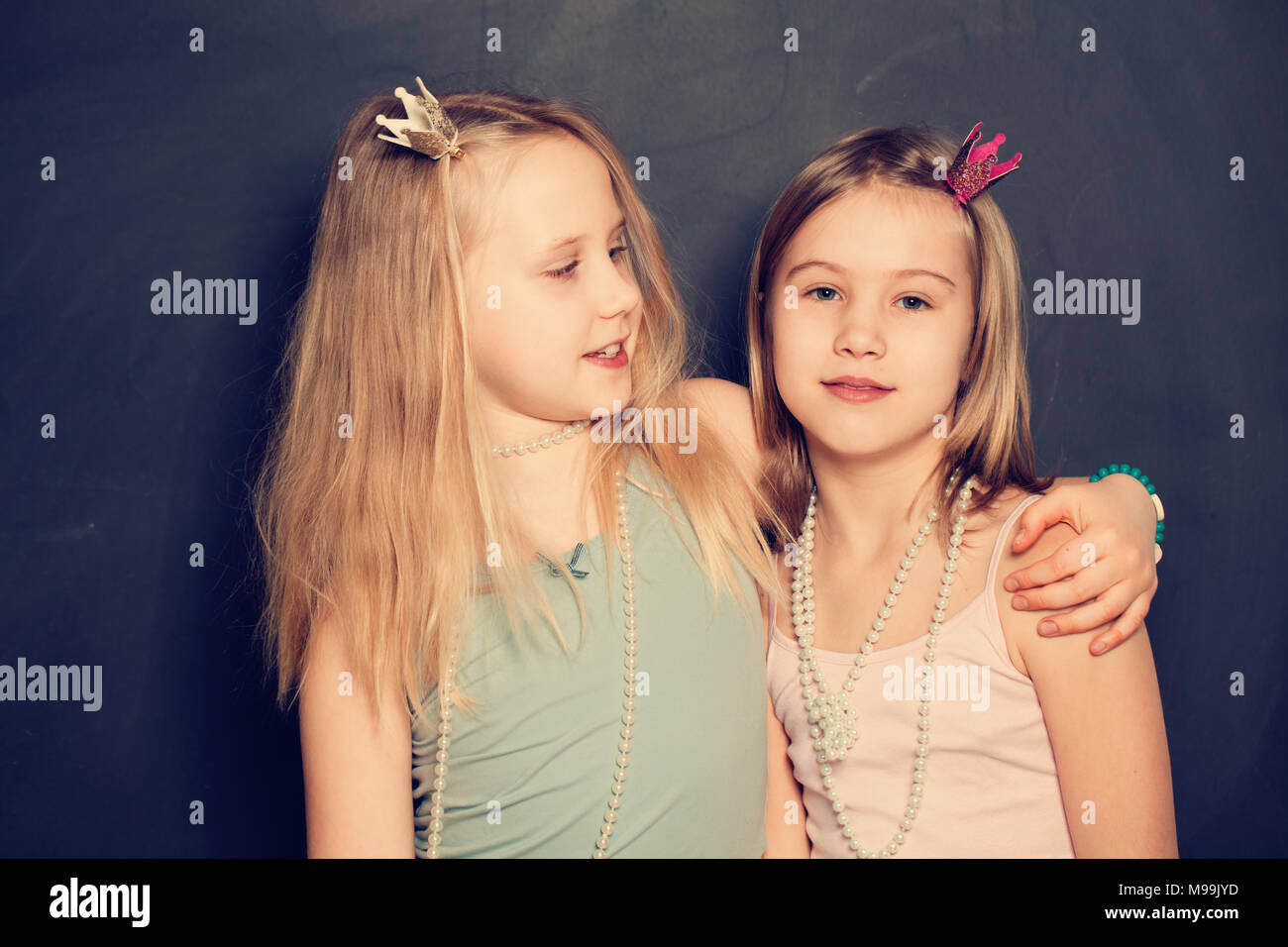 Two sisters smiling, portrait Stock Photo - Alamy