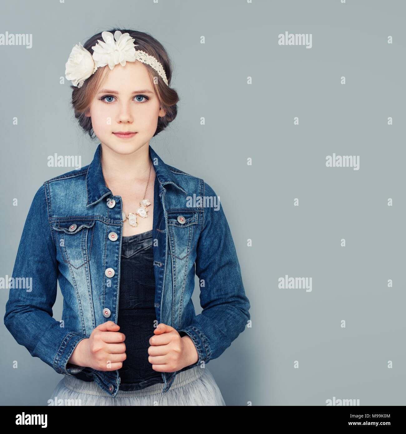 Pretty Young Girl on Light Blue Background Stock Photo - Alamy