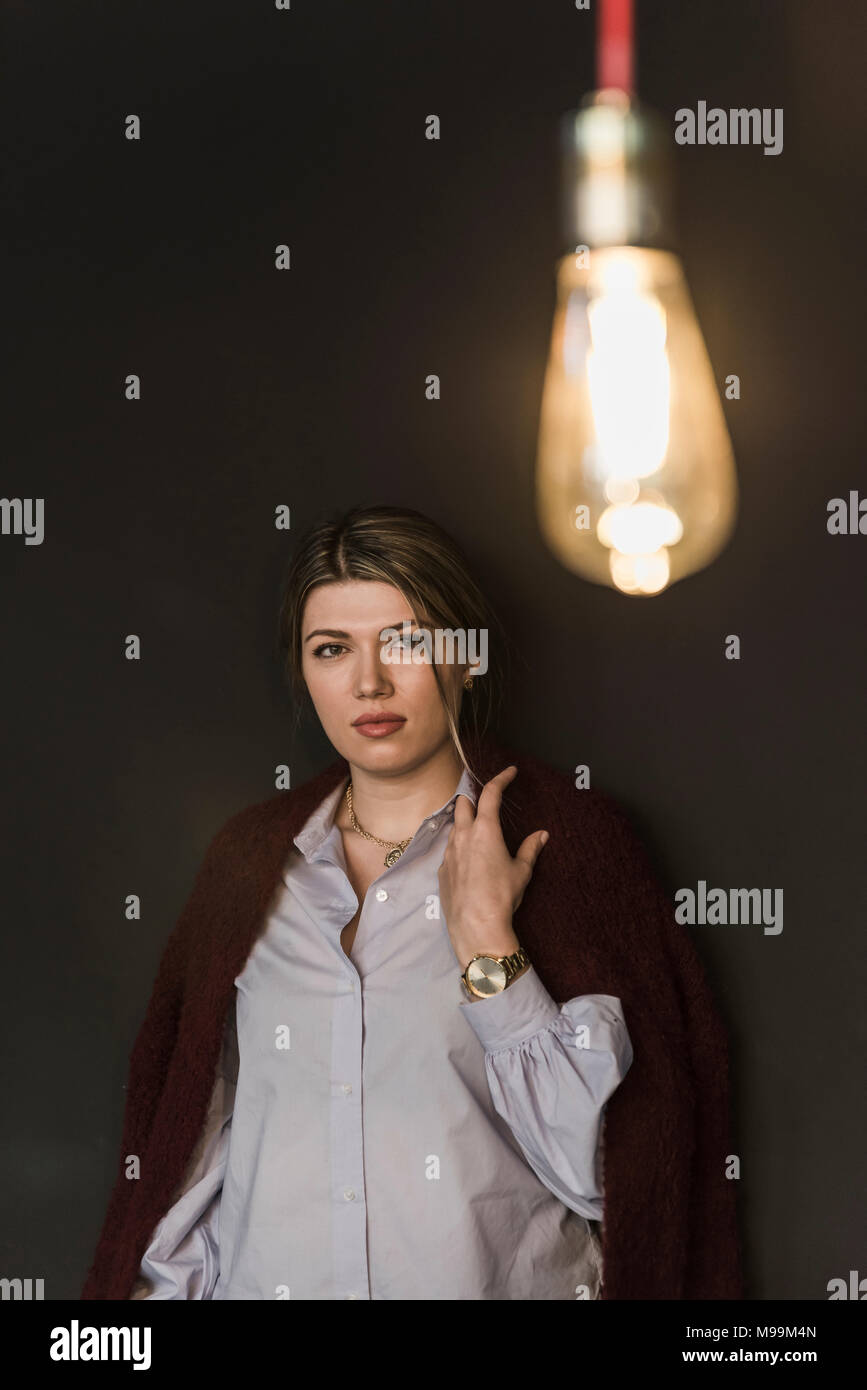 Young woman with illuminated light bulb Stock Photo - Alamy