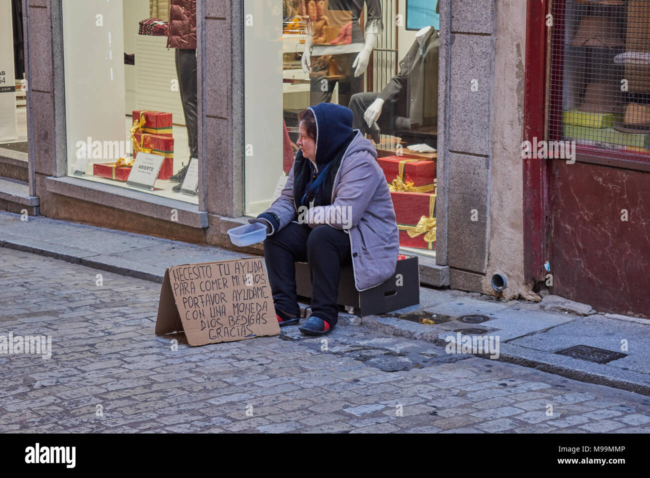 Homeless person with sign begging hi-res stock photography and images ...
