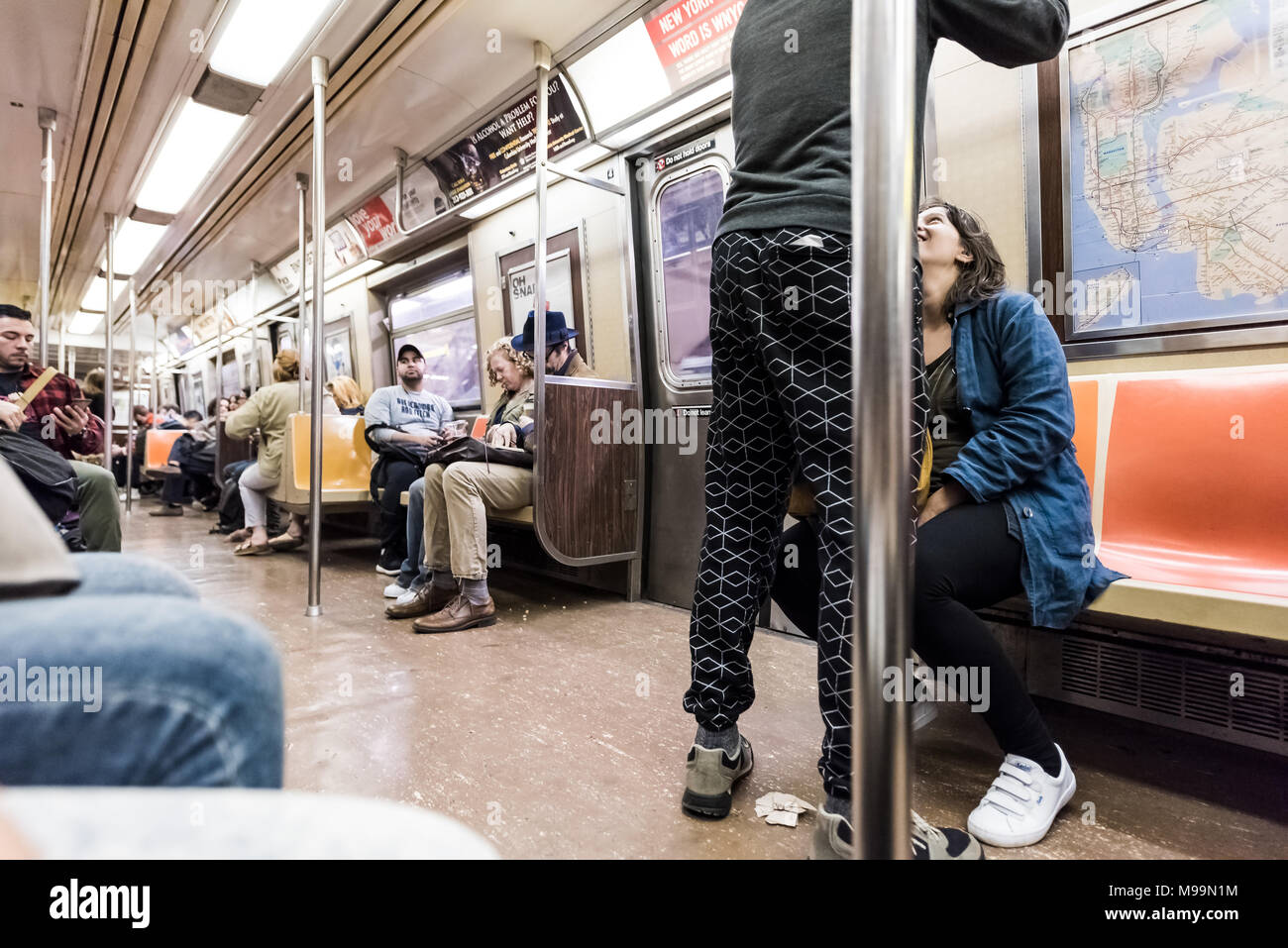 New York City, USA - October 28, 2017: People sitting on chairs in ...