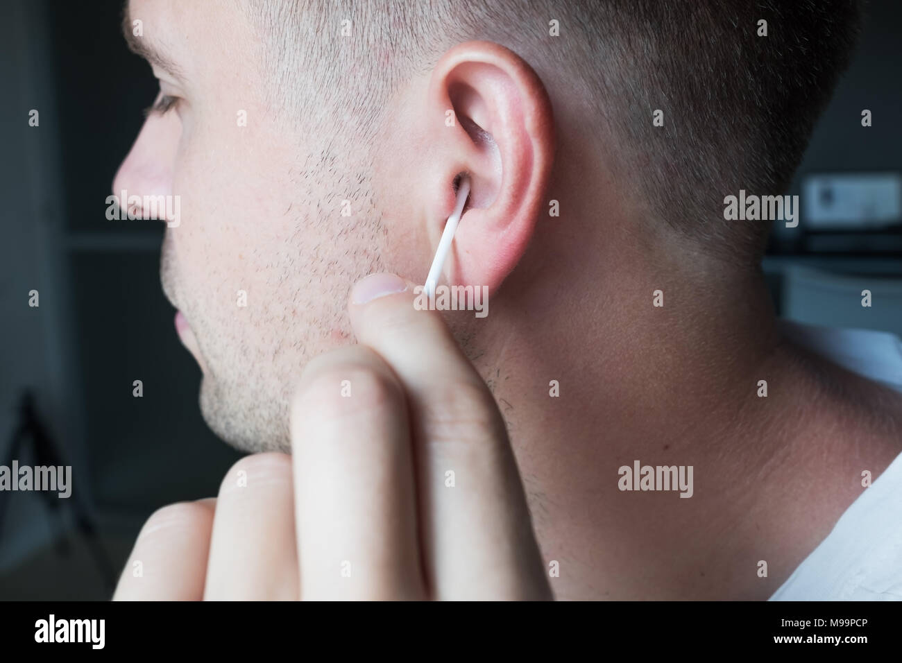 Ear man cleaning hi-res stock photography and images - Alamy