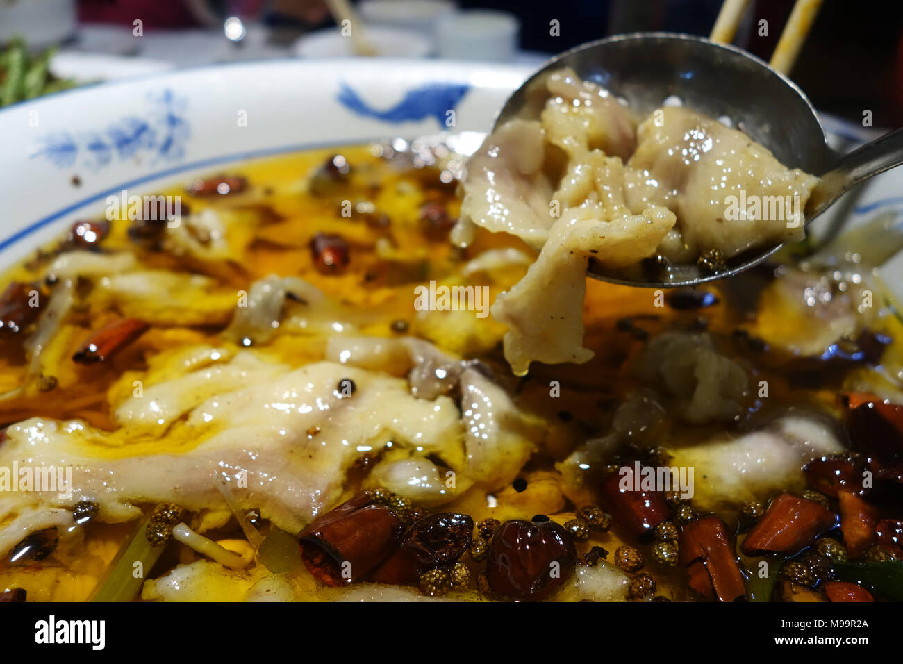 Fish fillets in hot chili oil. Chinese Sichuan cuisine Stock Photo - Alamy
