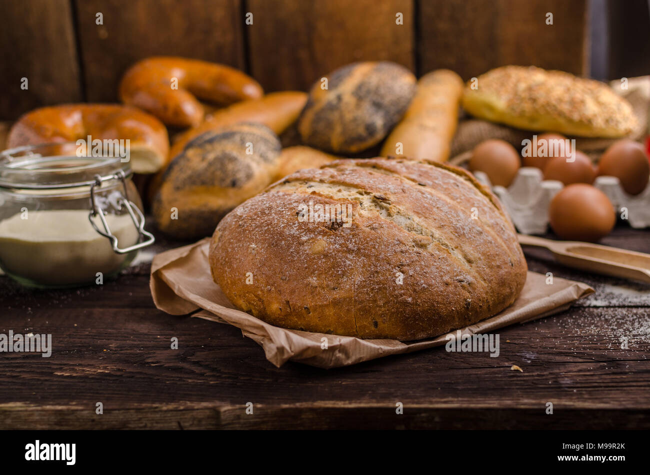 Homemade bread, product photo, selective focus, others pastries behind ...