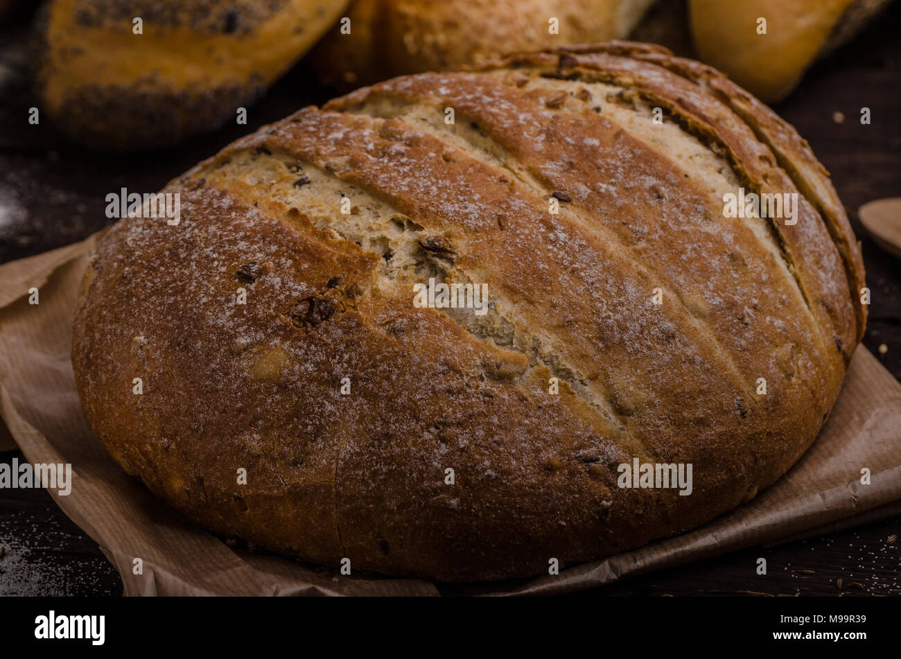Homemade bread, product photo, selective focus, others pastries behind ...