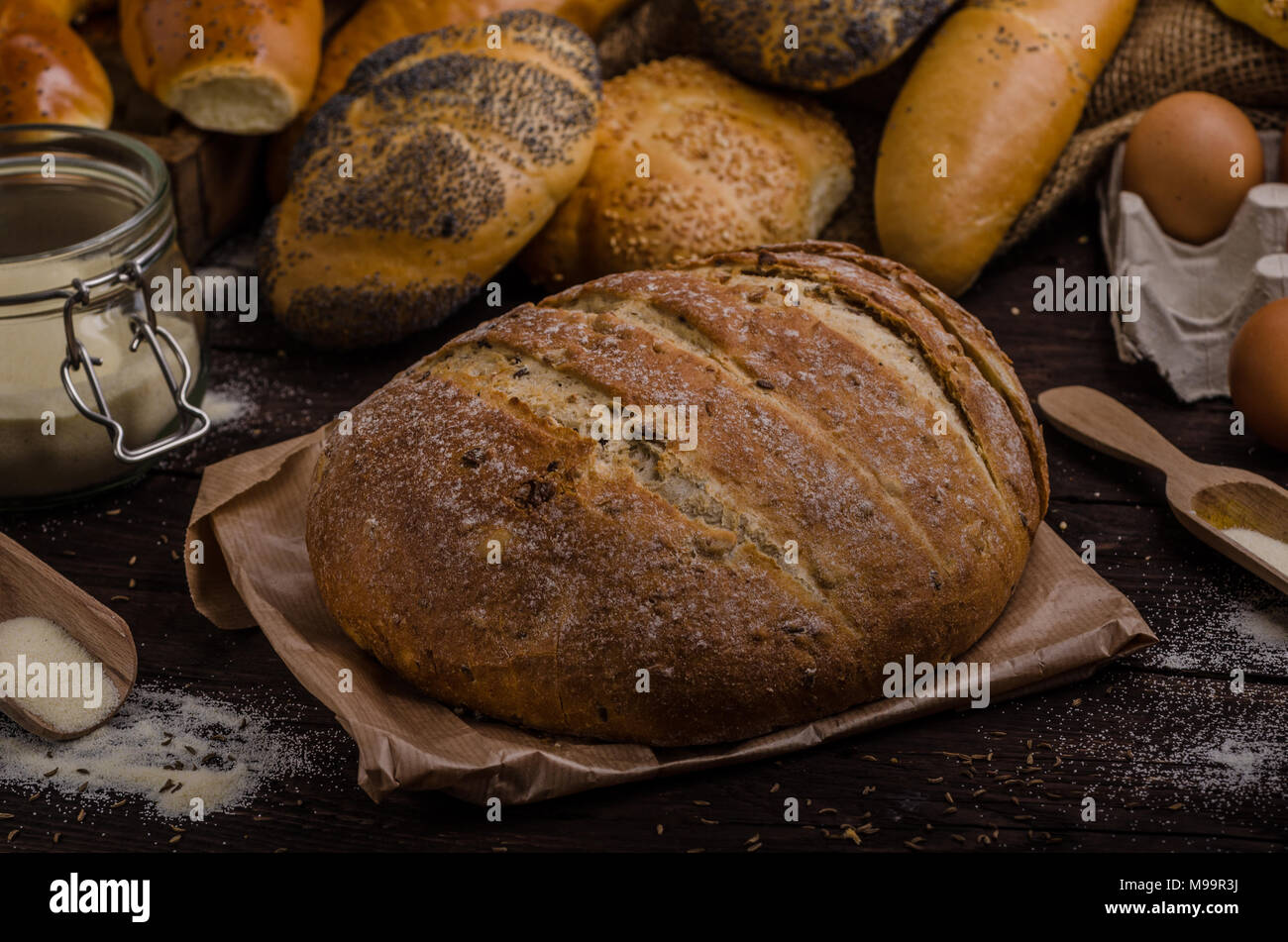 Homemade bread, product photo, selective focus, others pastries behind ...