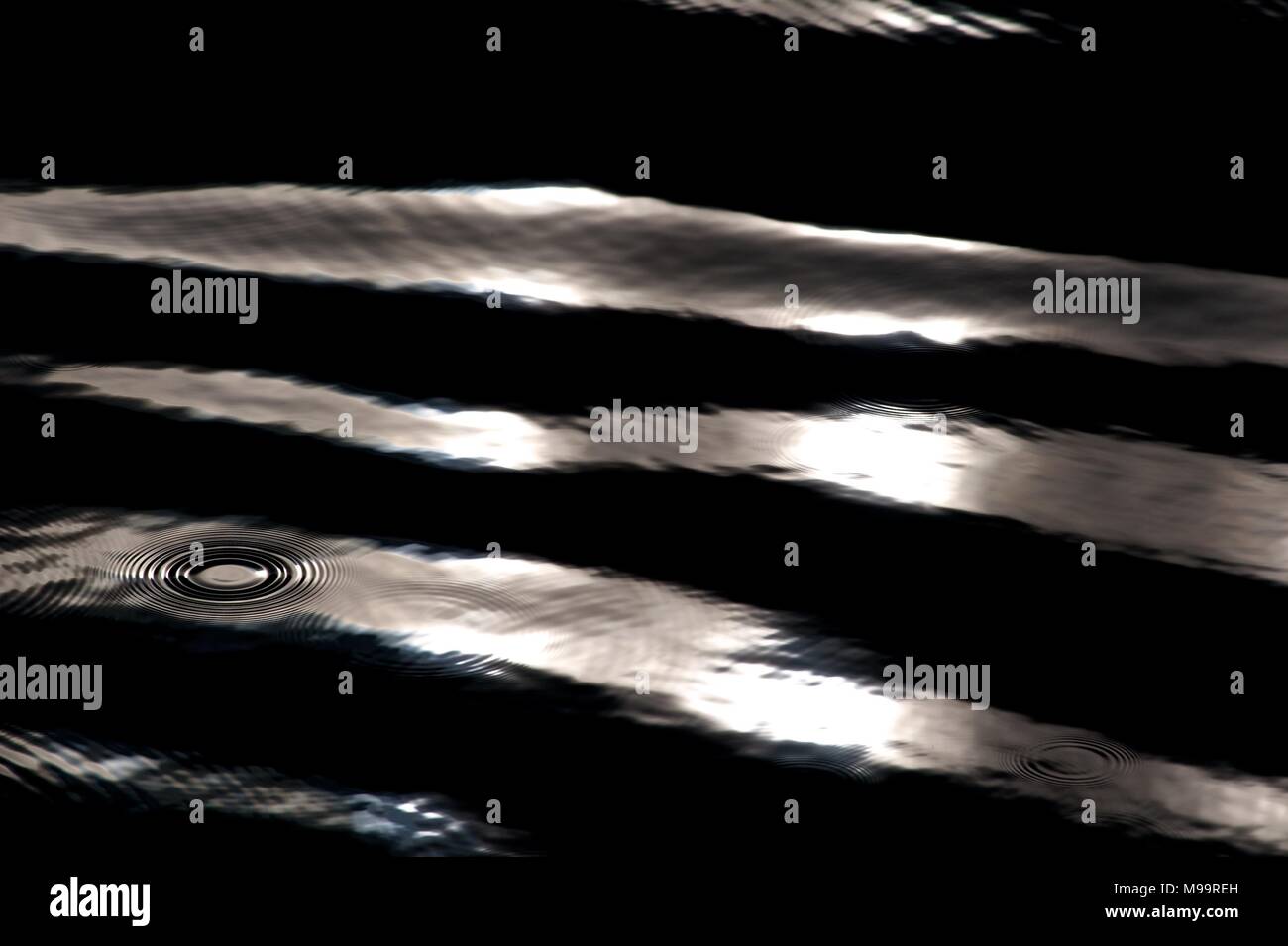 black water sunlight circular ripple Stock Photo - Alamy