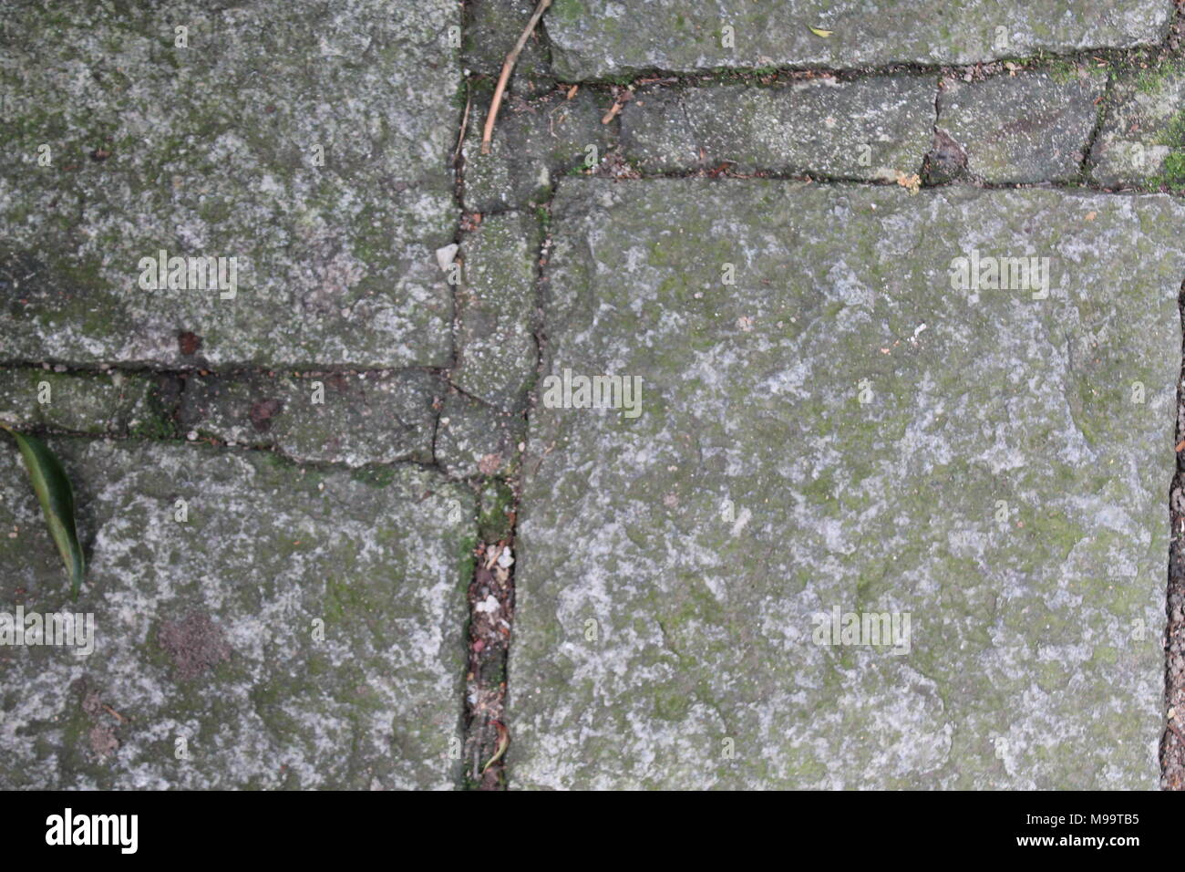 Elegant stone wall from small square parts. Rock texture Stock Photo ...